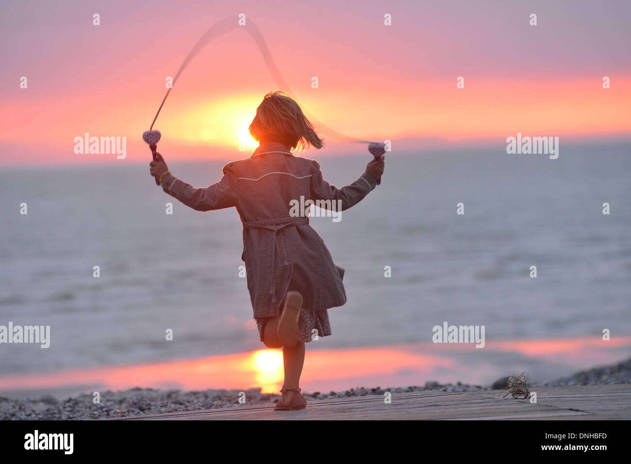 Little girl jumping rope hi-res stock photography and images - Alamy