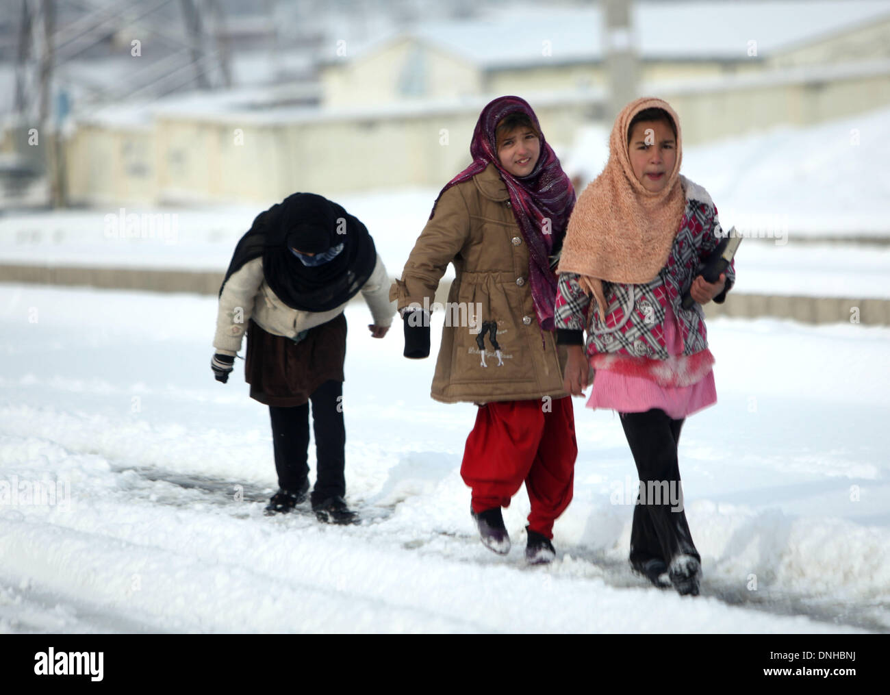 Kabul, Afghanistan. 30th Dec, 2013. Afghan girls walk on the snow in ...