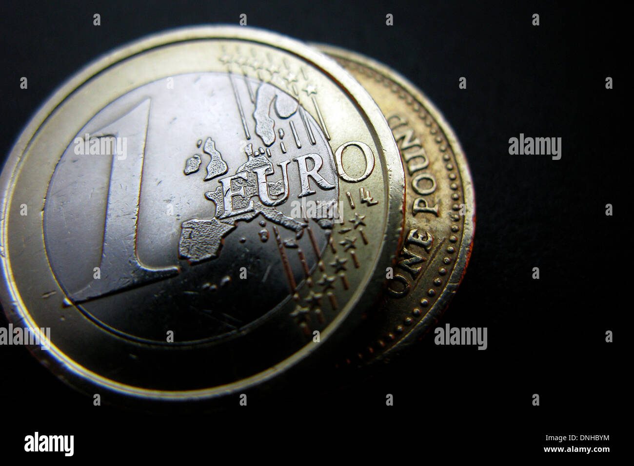 A picture shows a 1 Euro coin and a 1 Pound coin Stock Photo - Alamy