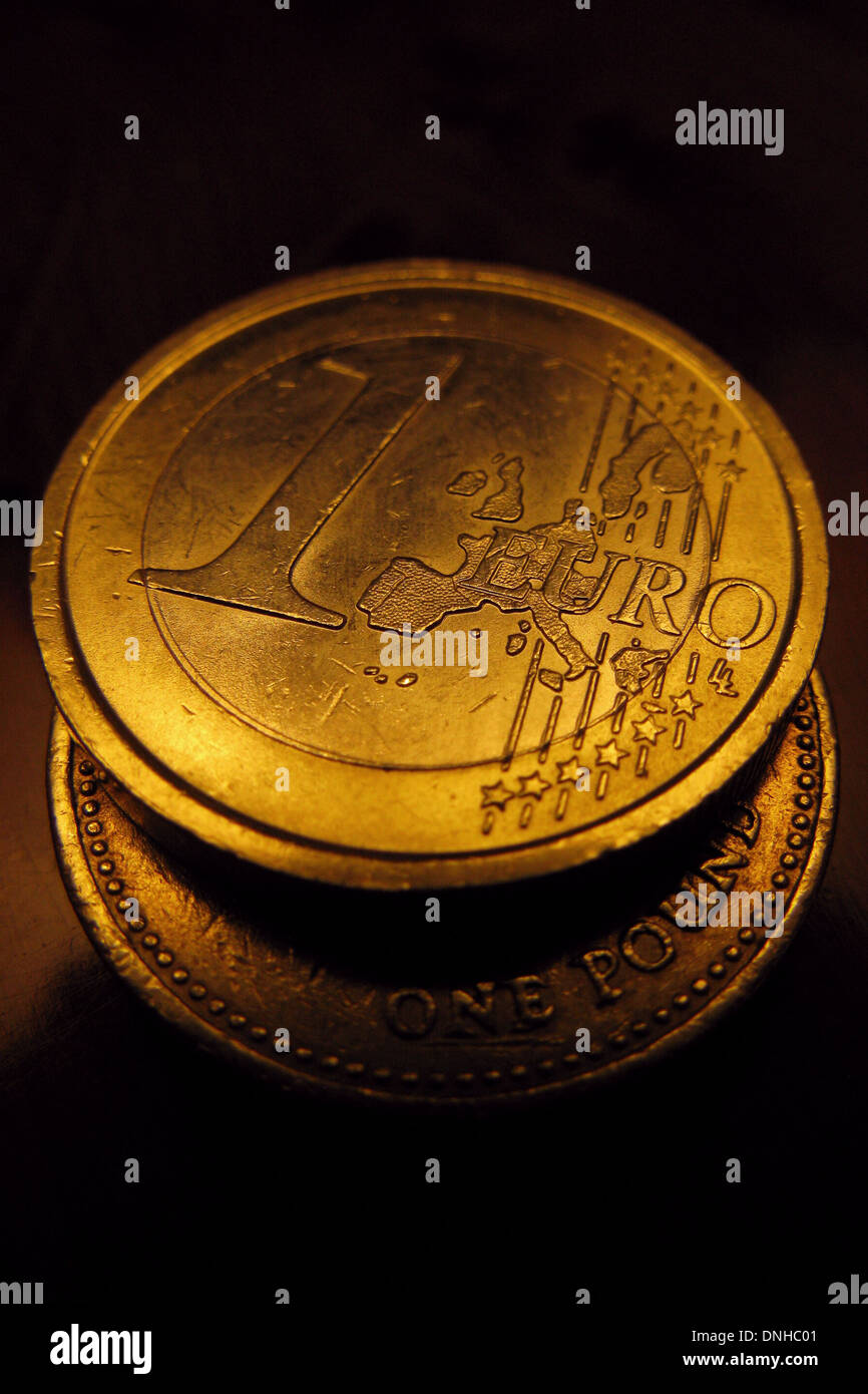A picture shows a 1 Euro coin and a 1 Pound coin Stock Photo - Alamy