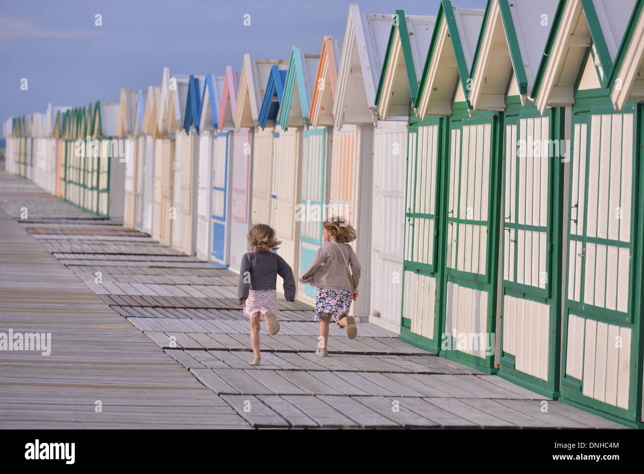 LITTLE GIRLS RUNNING NEAR THE BEACH HUTS OF CAYEUX-SUR-MER, SOMME (80 ...