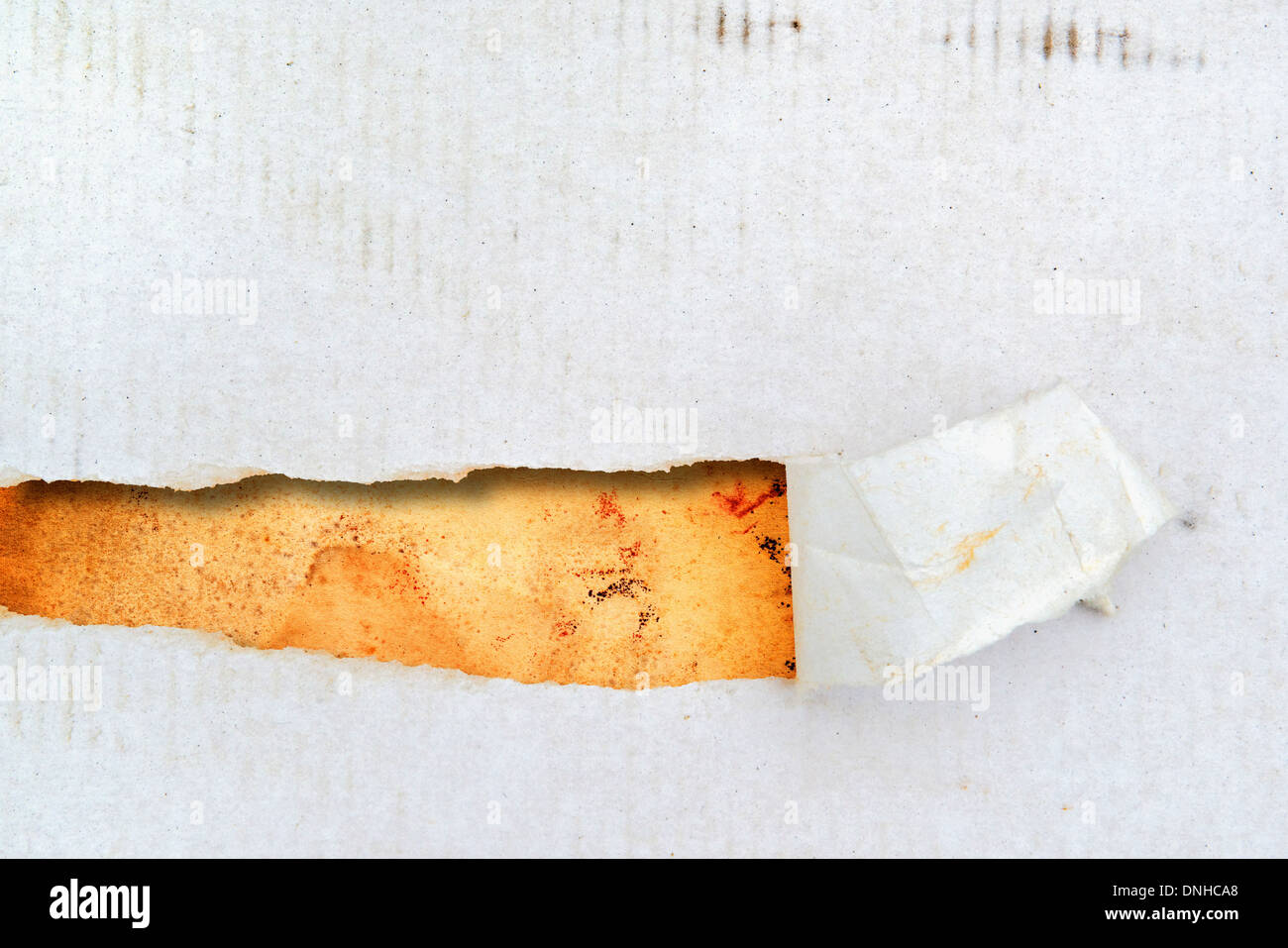 Torn dirty cardboard paper as a background for your title or design ...