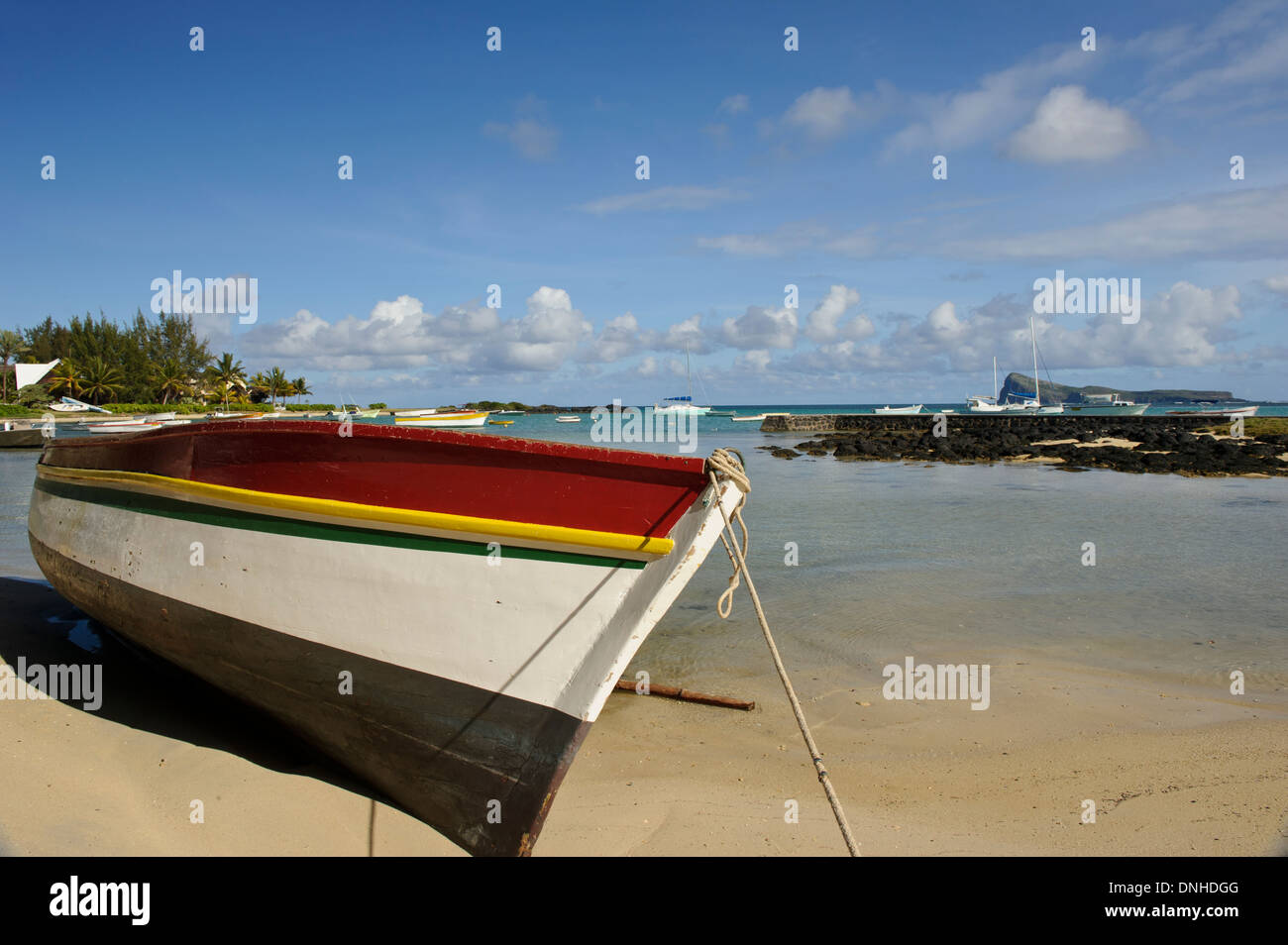 A colourful small fishing boat on the beach, Cap Malheureux, Mauritius ...