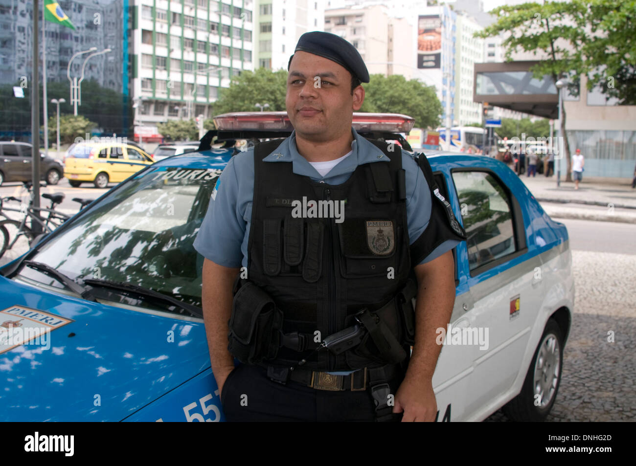 A Tourist Police officer beside his patrol car at Copacabana Beach in ...