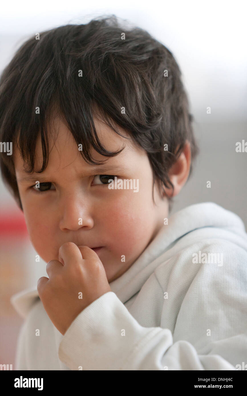 Portrait of an angry little boy Stock Photo - Alamy