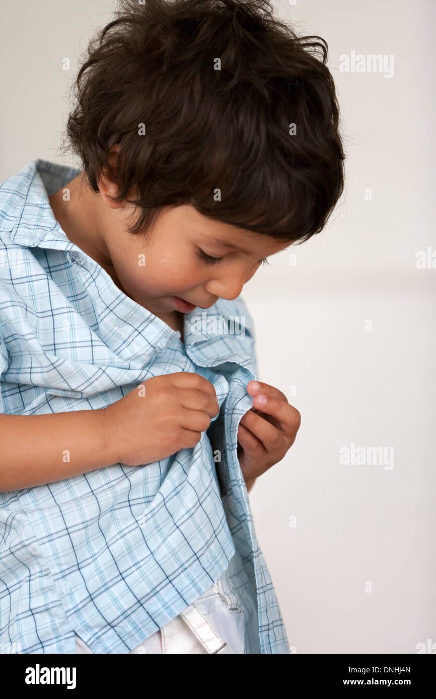 Fasten the button hi-res stock photography and images - Alamy