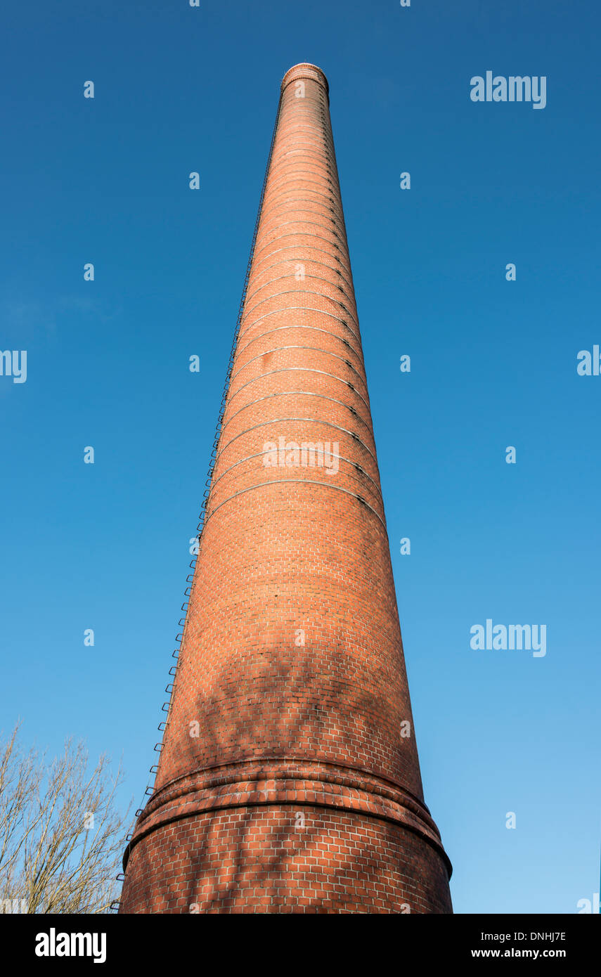 60 meter high chimney on blue sky Stock Photo - Alamy