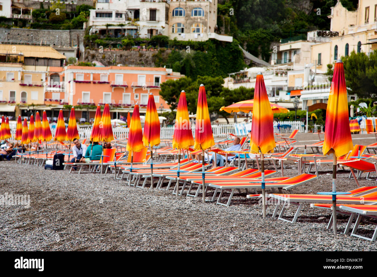 Beach umbrellas and lounge chairs on the beach, Positano, Amalfi Coast ...