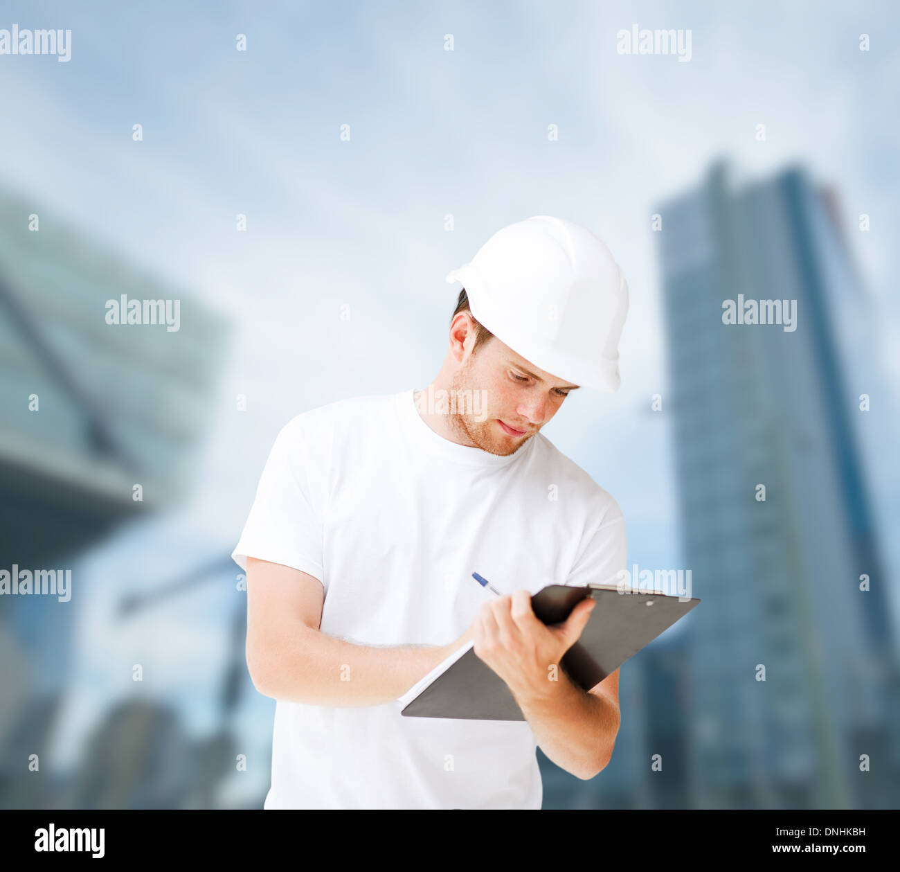 male architect looking at blueprint Stock Photo - Alamy