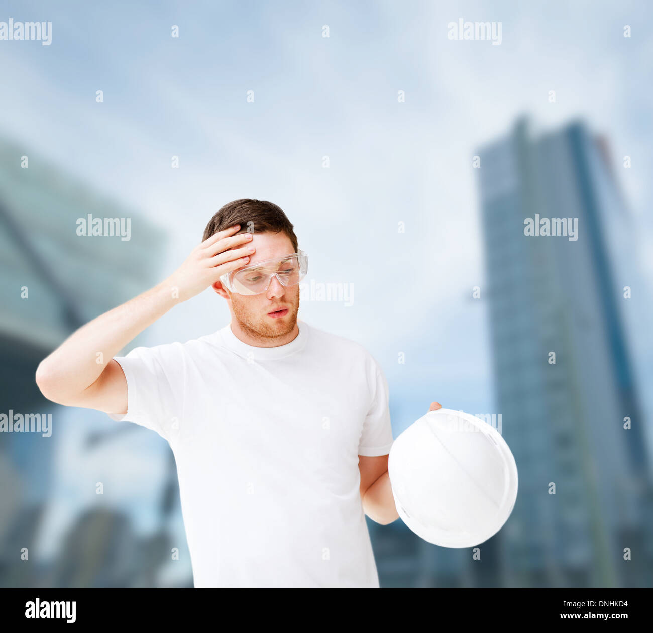 male architect in safety glasses taking off helmet Stock Photo - Alamy