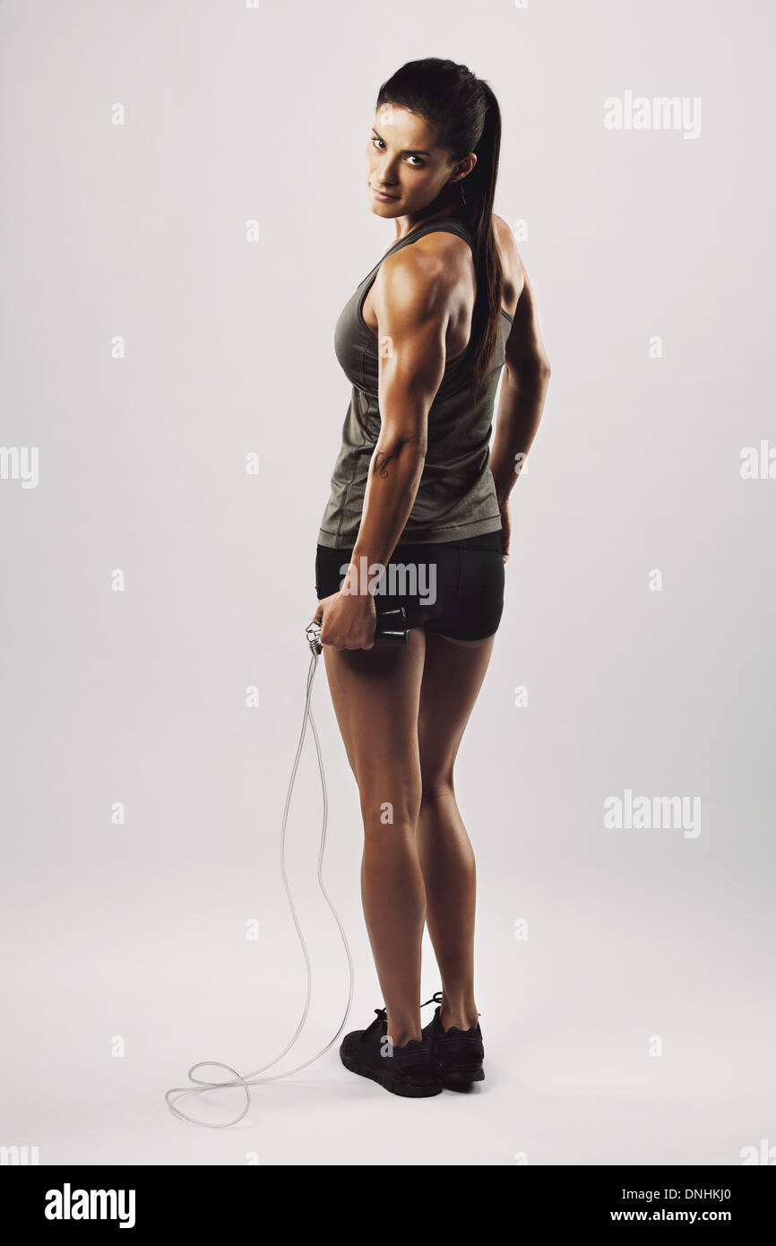 Woman looking over shoulder full body hi-res stock photography and ...
