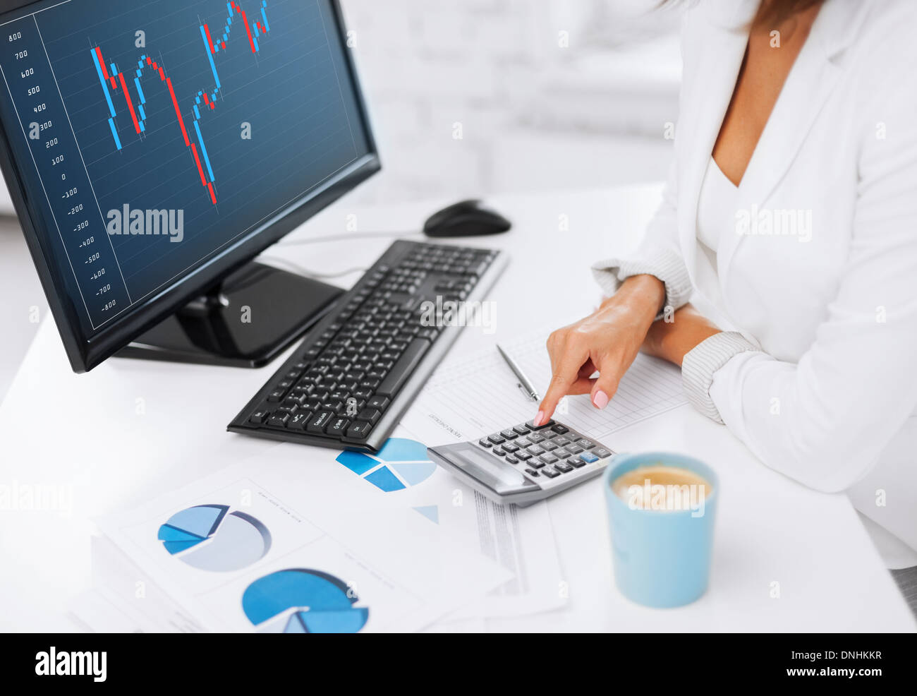 Businesswoman analyzing financial charts calculator hi-res stock ...