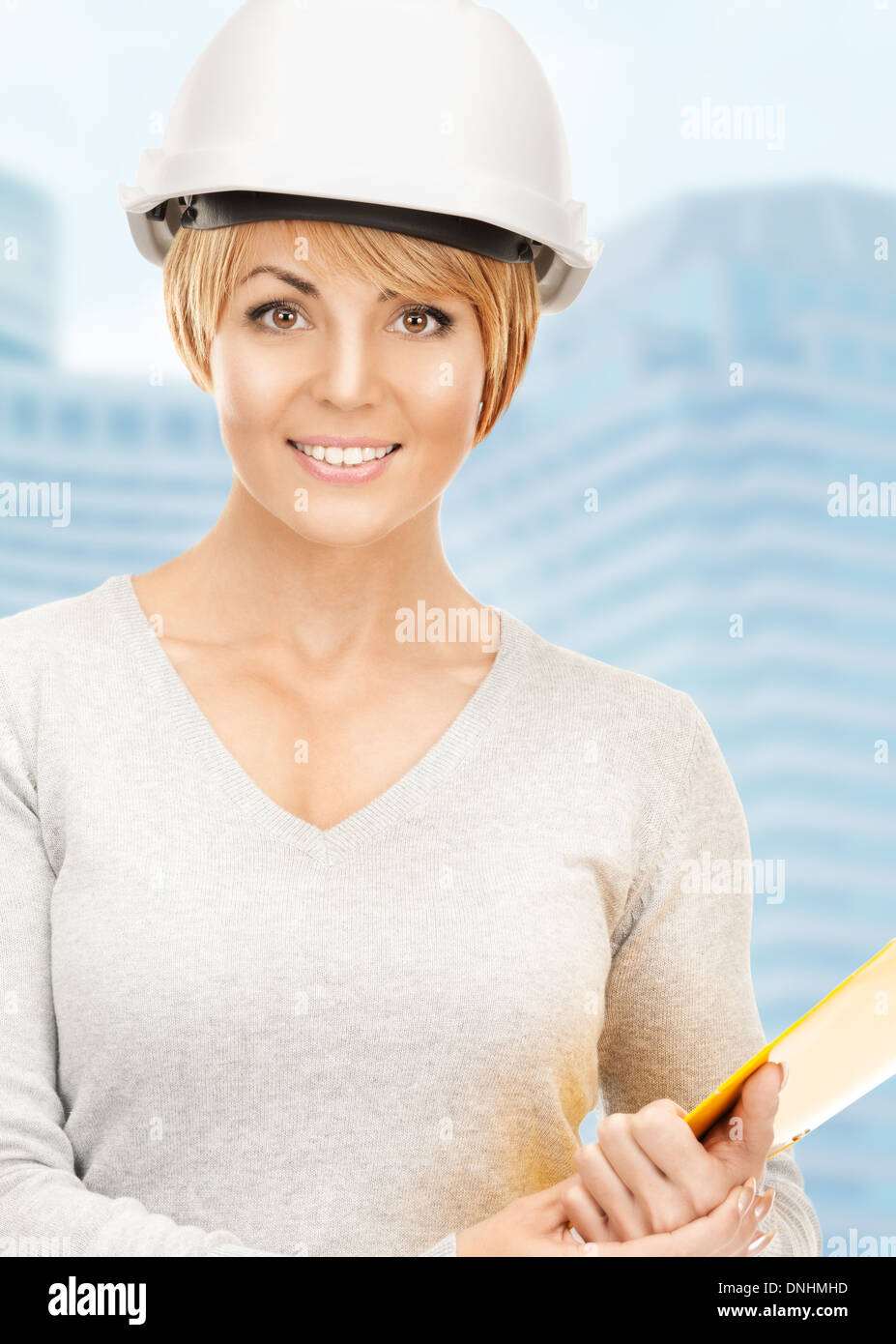 female contractor in helmet with bluepring Stock Photo - Alamy