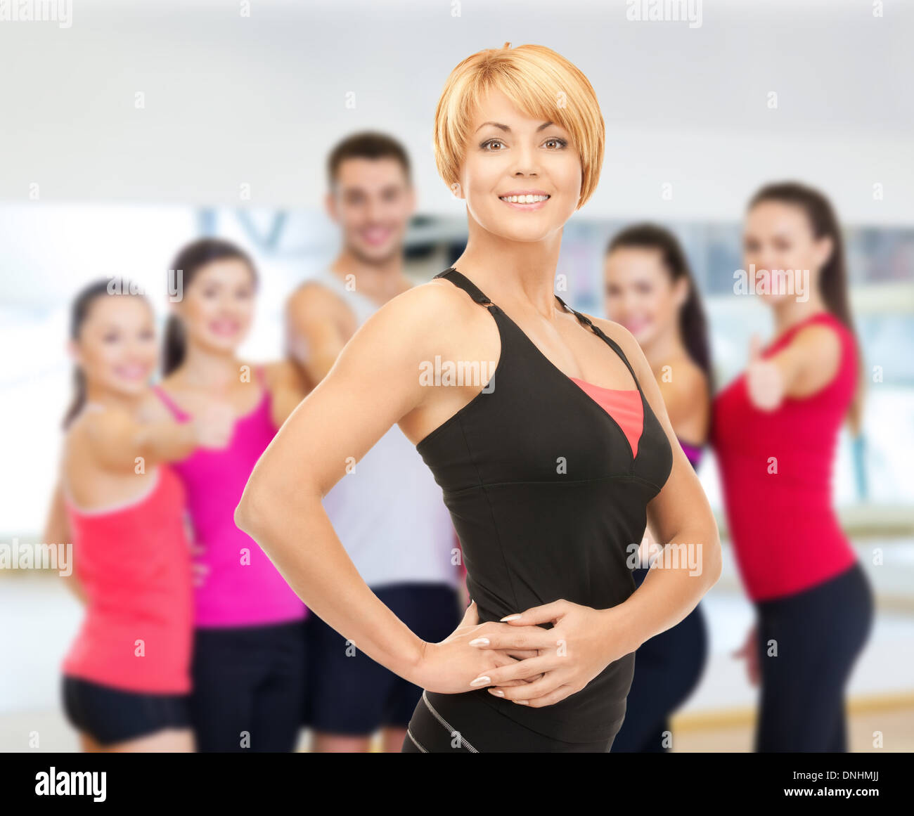group of smiling people exercising in the gym Stock Photo - Alamy