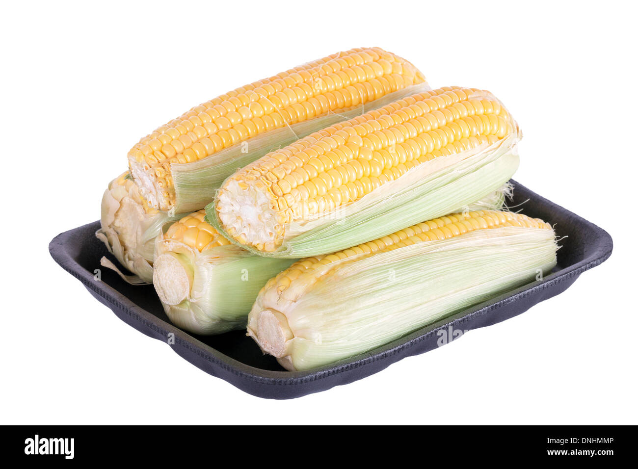 corn folded into a box on a white background Stock Photo - Alamy