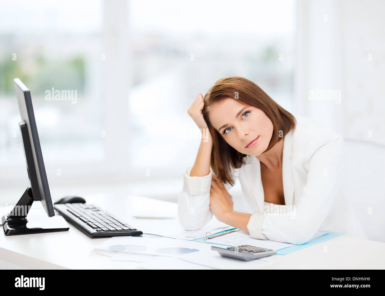 Confused woman calculator paperwork hi-res stock photography and images ...