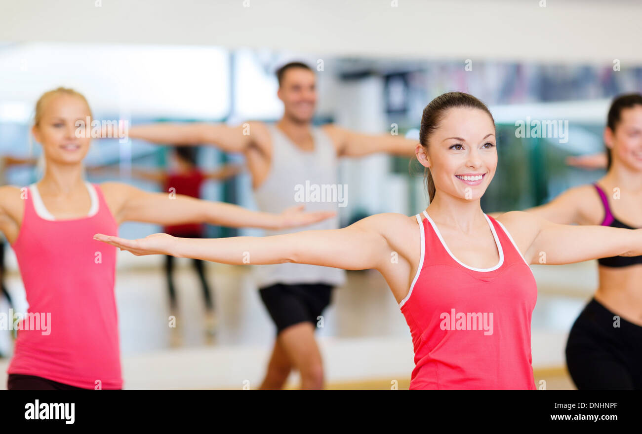 group of smiling people exercising in the gym Stock Photo - Alamy
