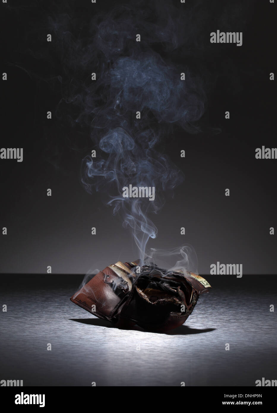 A burnt brown leather wallet filled with credit cards and money Stock ...