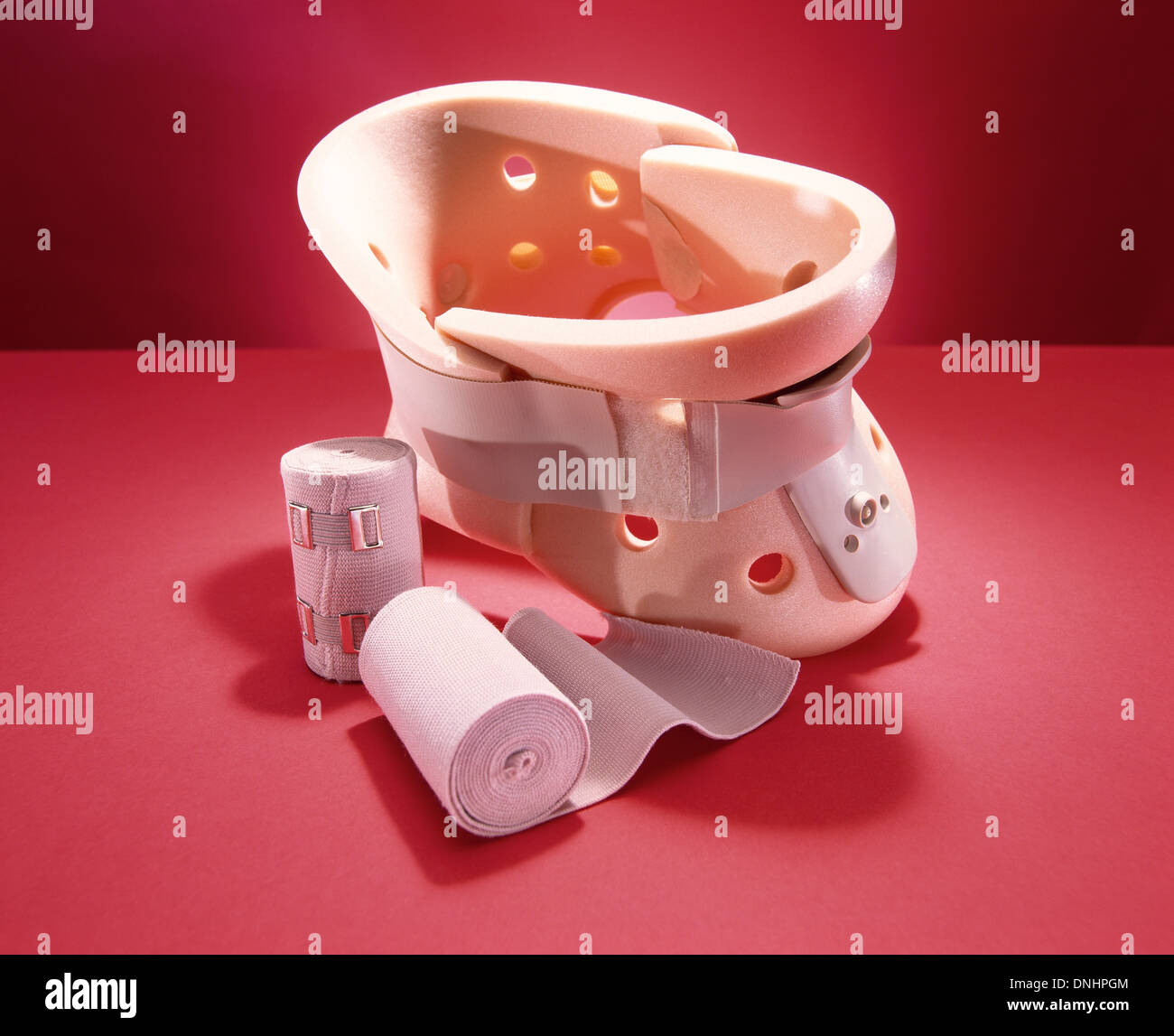 Emergency medical supplies; neck brace, gauze and bandages. Bright red ...