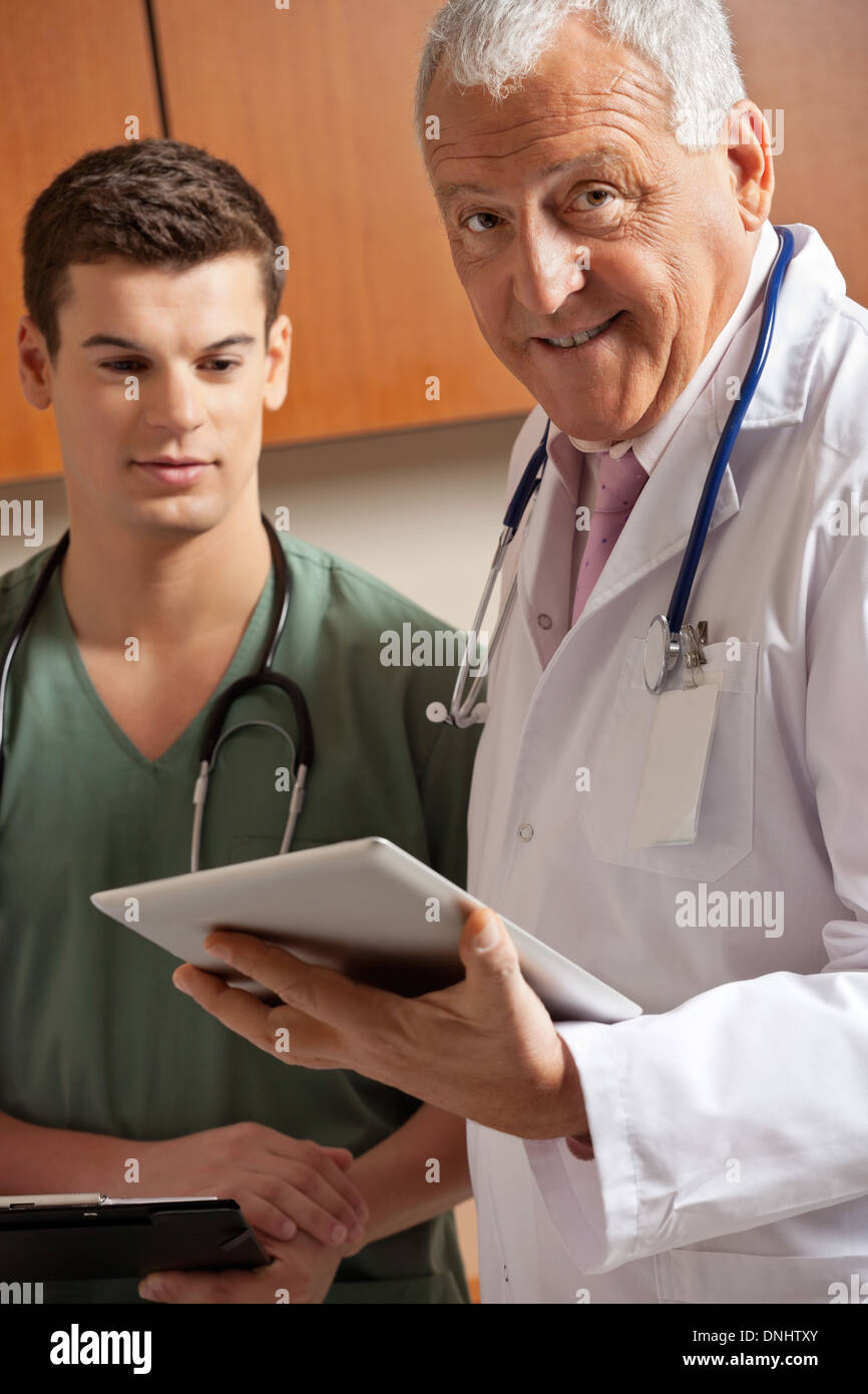 Senior Doctor Holding Clipboard Stock Photo - Alamy