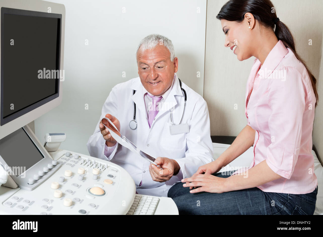 Radiologist Showing Ultrasound Print To Patient Stock Photo - Alamy