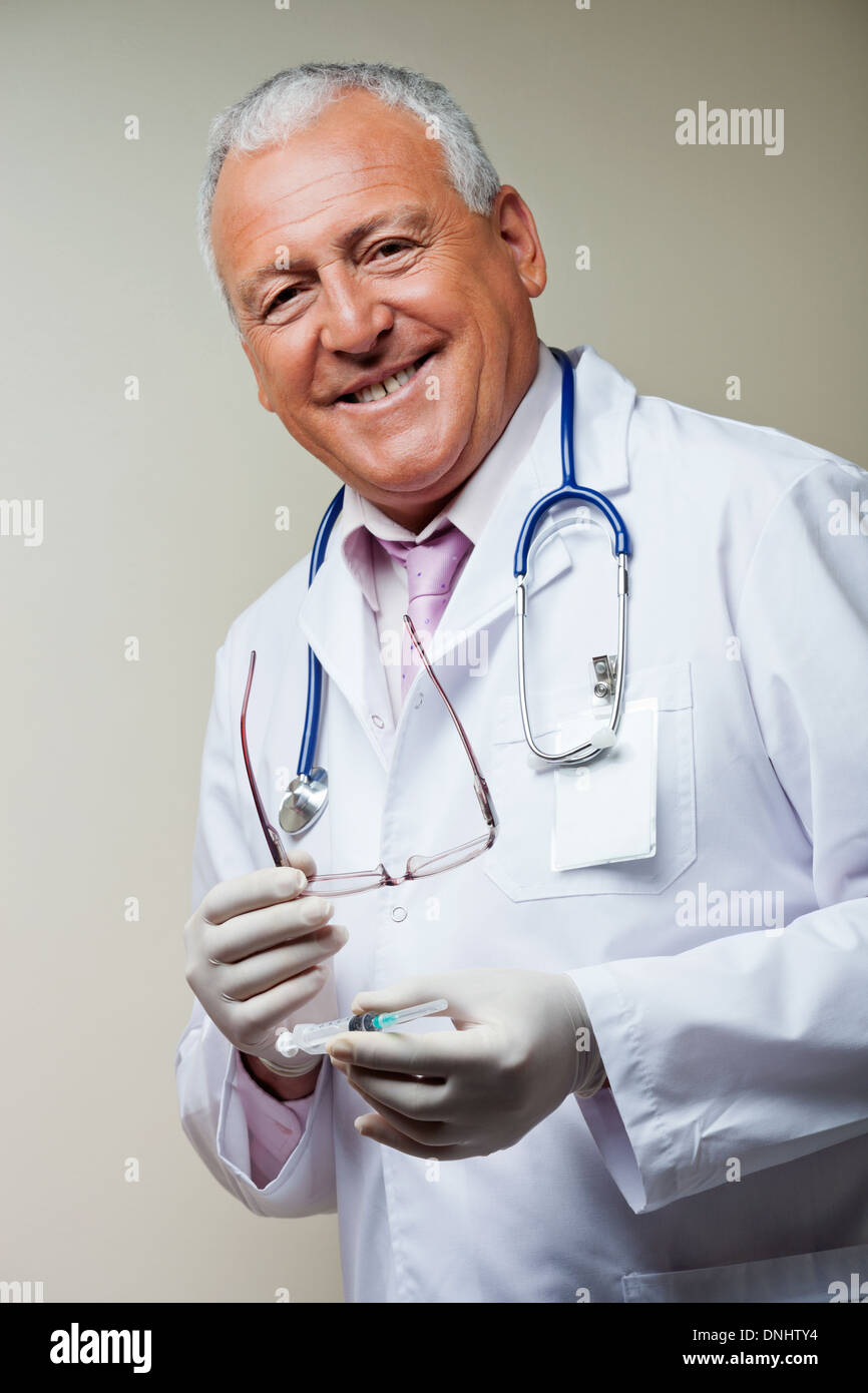 Doctor Holding Sterilized Syringe Stock Photo - Alamy
