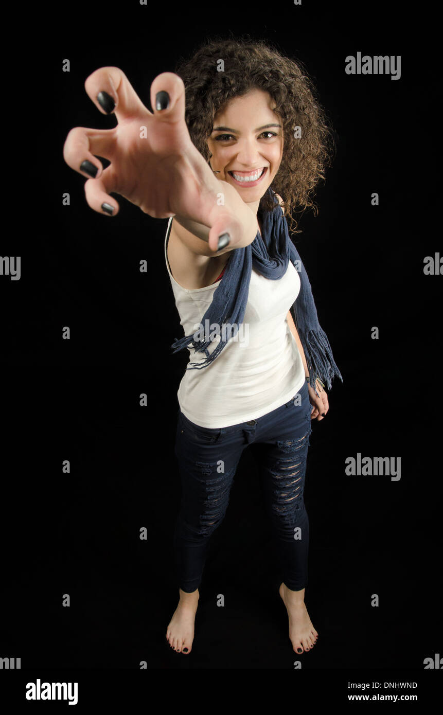 Young Woman in Grabbing Pose Stock Photo - Alamy
