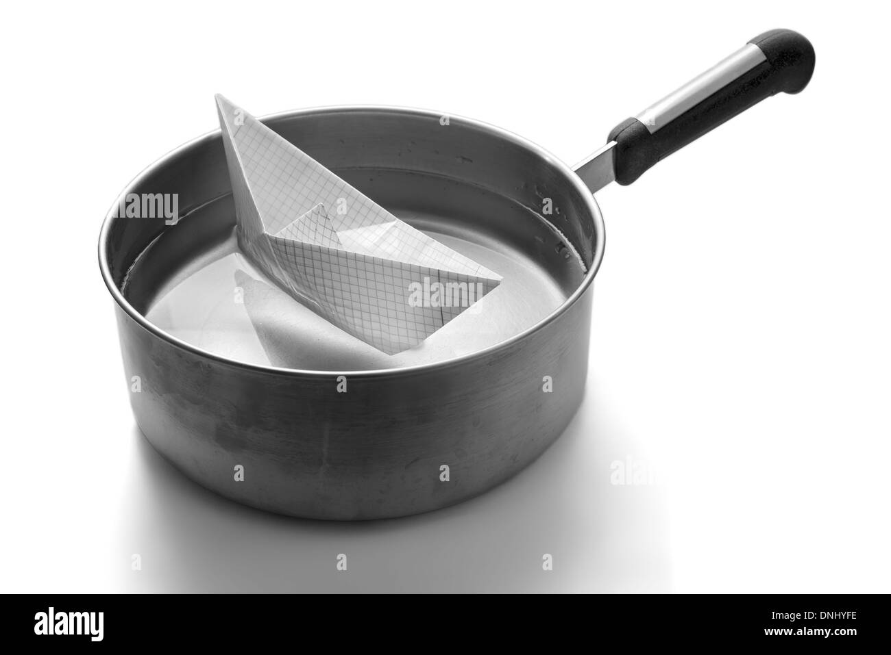Paper boat sailing in a saucepan. White and black. Isolated on white ...