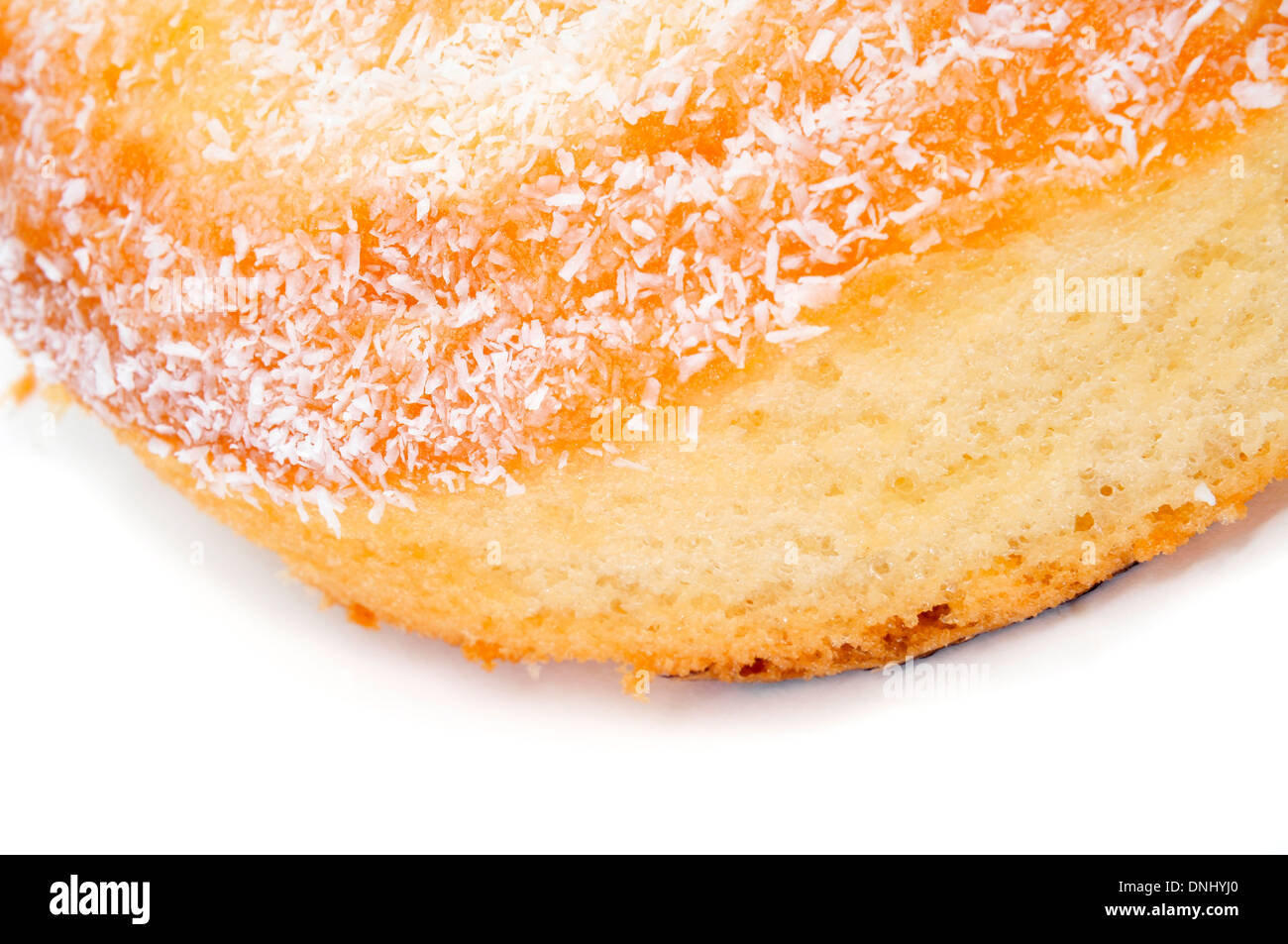 closeup of a coconut sponge cake on a white background Stock Photo - Alamy