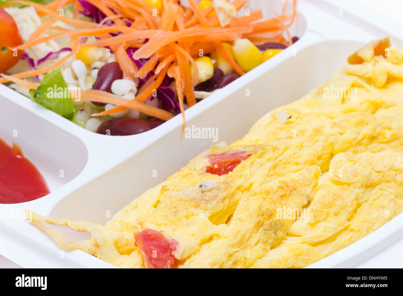 Omelette with fresh salad in white plastic box Stock Photo - Alamy