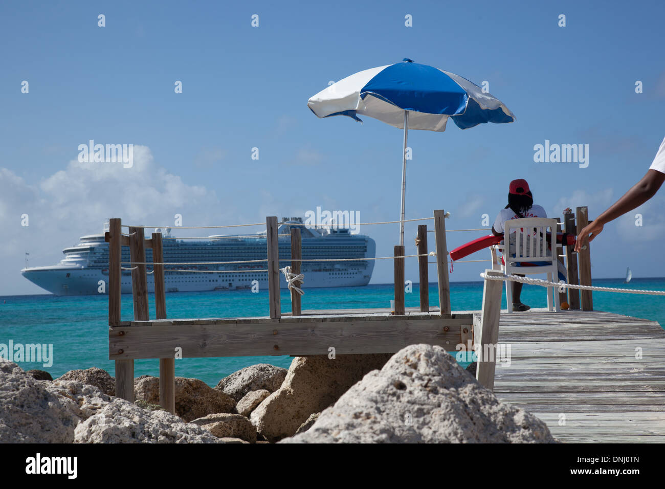 Cruise ship anchored off the Bahaman island of Eleuthera. A lifeguard ...