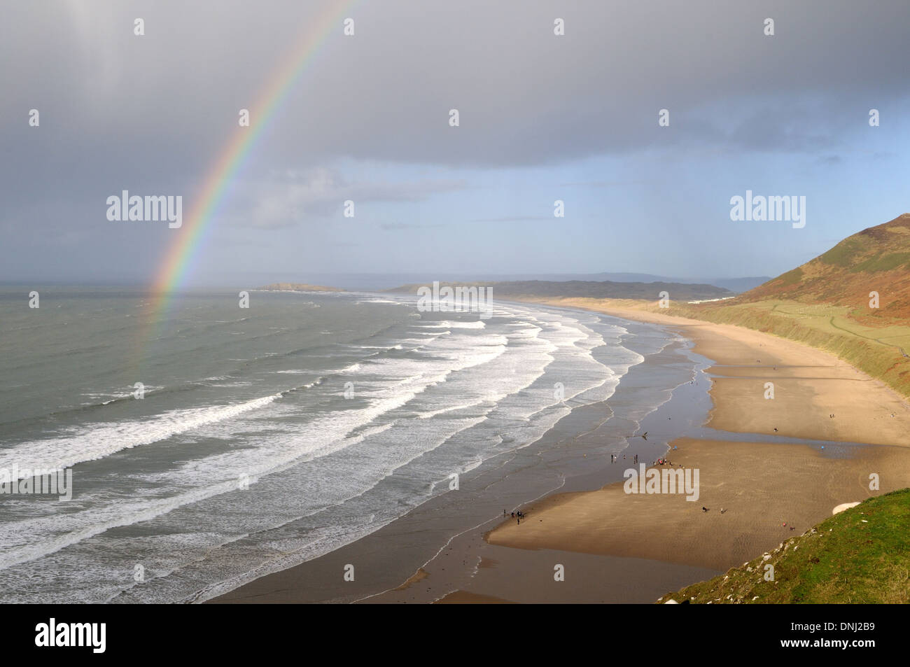 Rainbow over sea at Rhossili Beach Gower Peninsula Glamorgan Wales ...