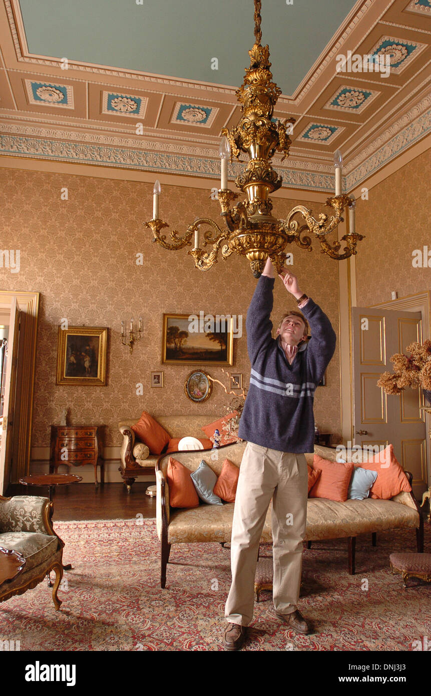 Freddie Giffard checking ornate chandelier at Chillington Hall the ...