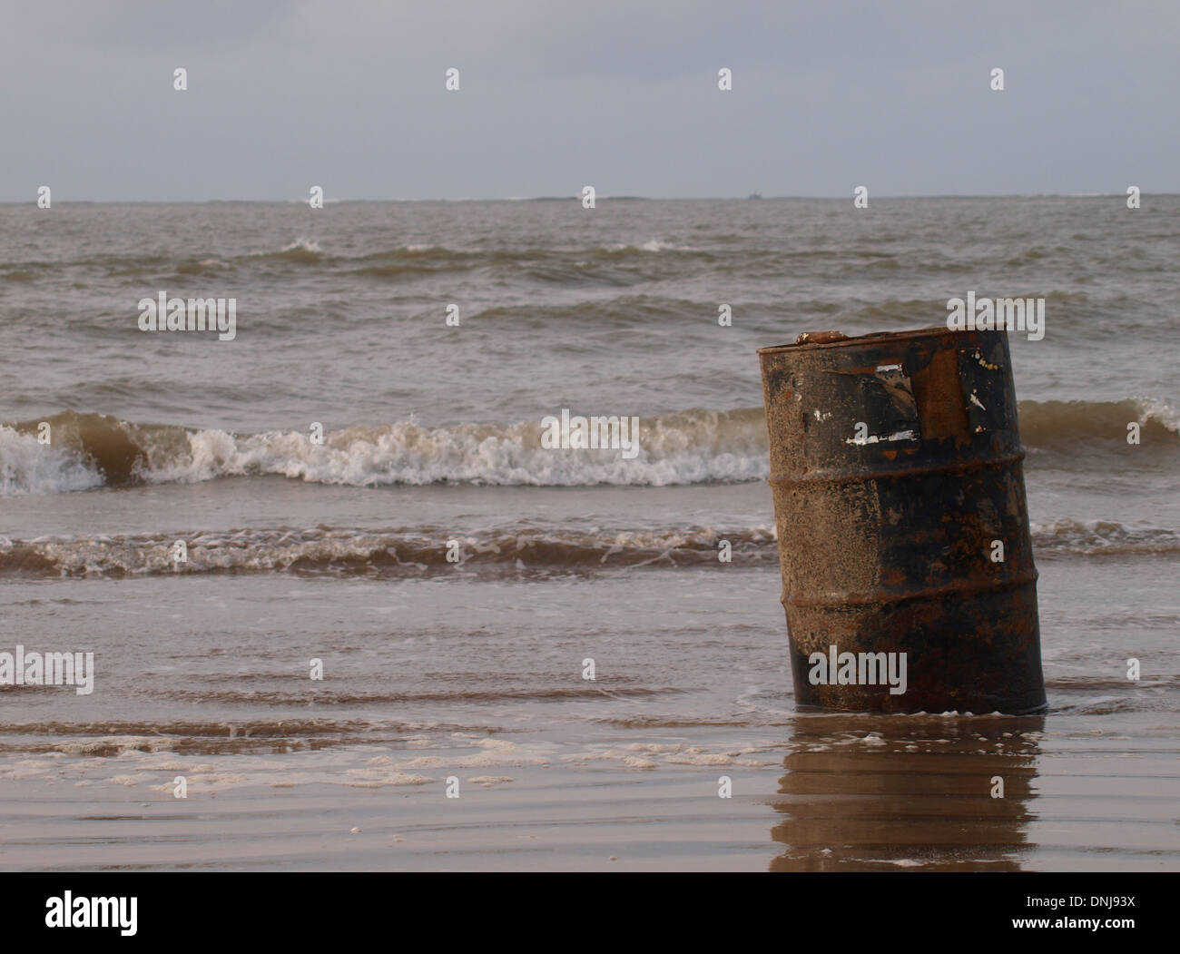 Old rusty barrel washed up on a beach, Instow, Devon, UK Stock Photo ...