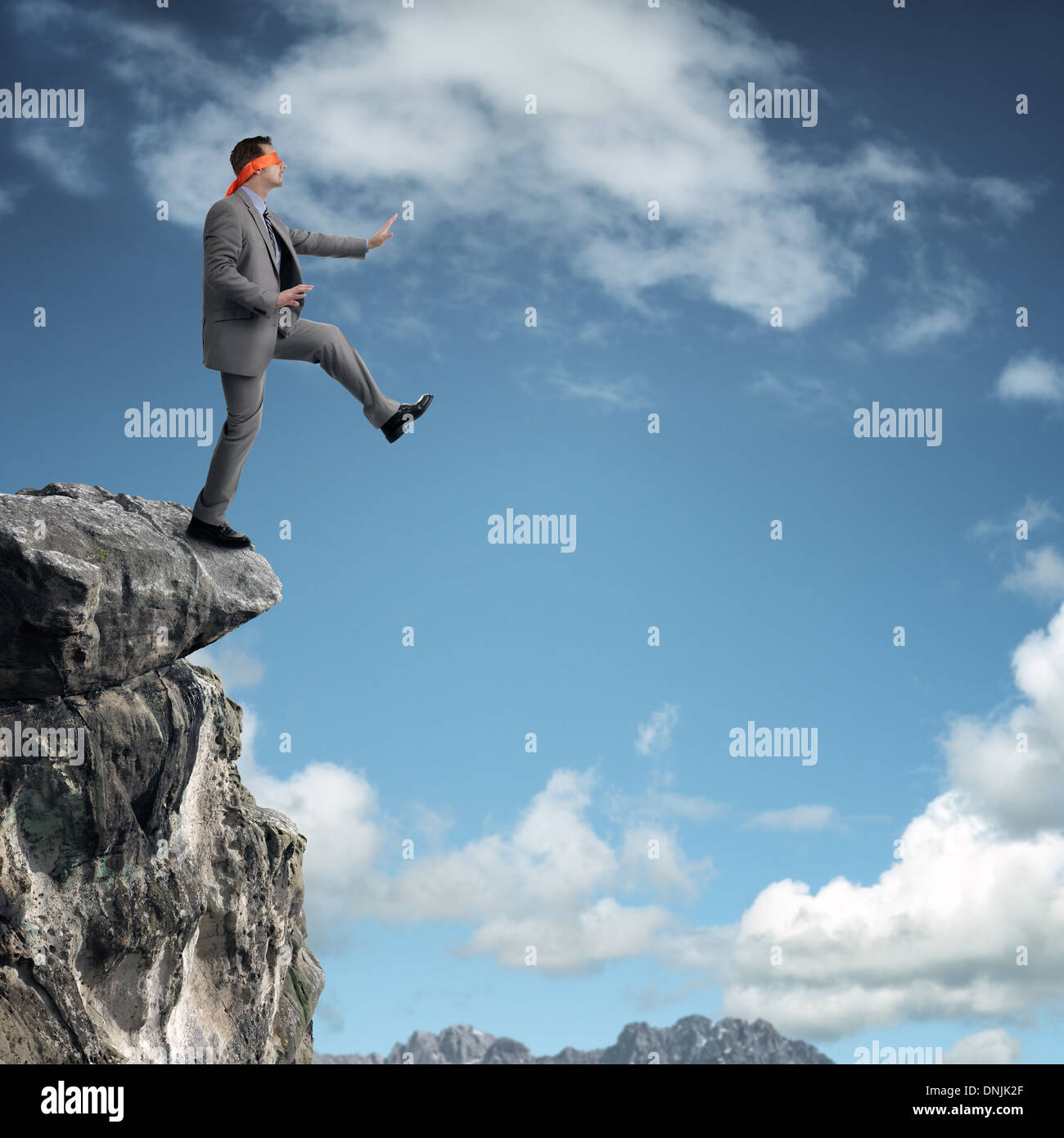 Stepping off a cliff ledge Stock Photo: 64948983 - Alamy