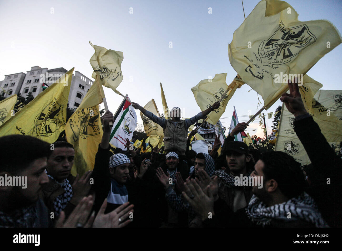 Gaza, Palestinian Territories. 31st Dec, 2013. Palestinians wave yellow ...