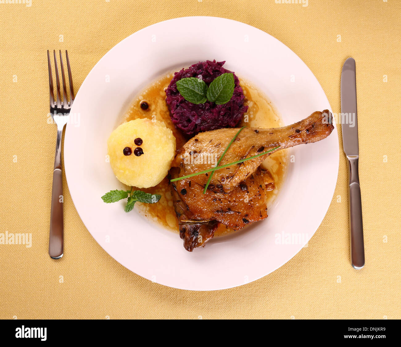 Duck leg with potato dumplings, red cabbage and gravy, top view Stock ...