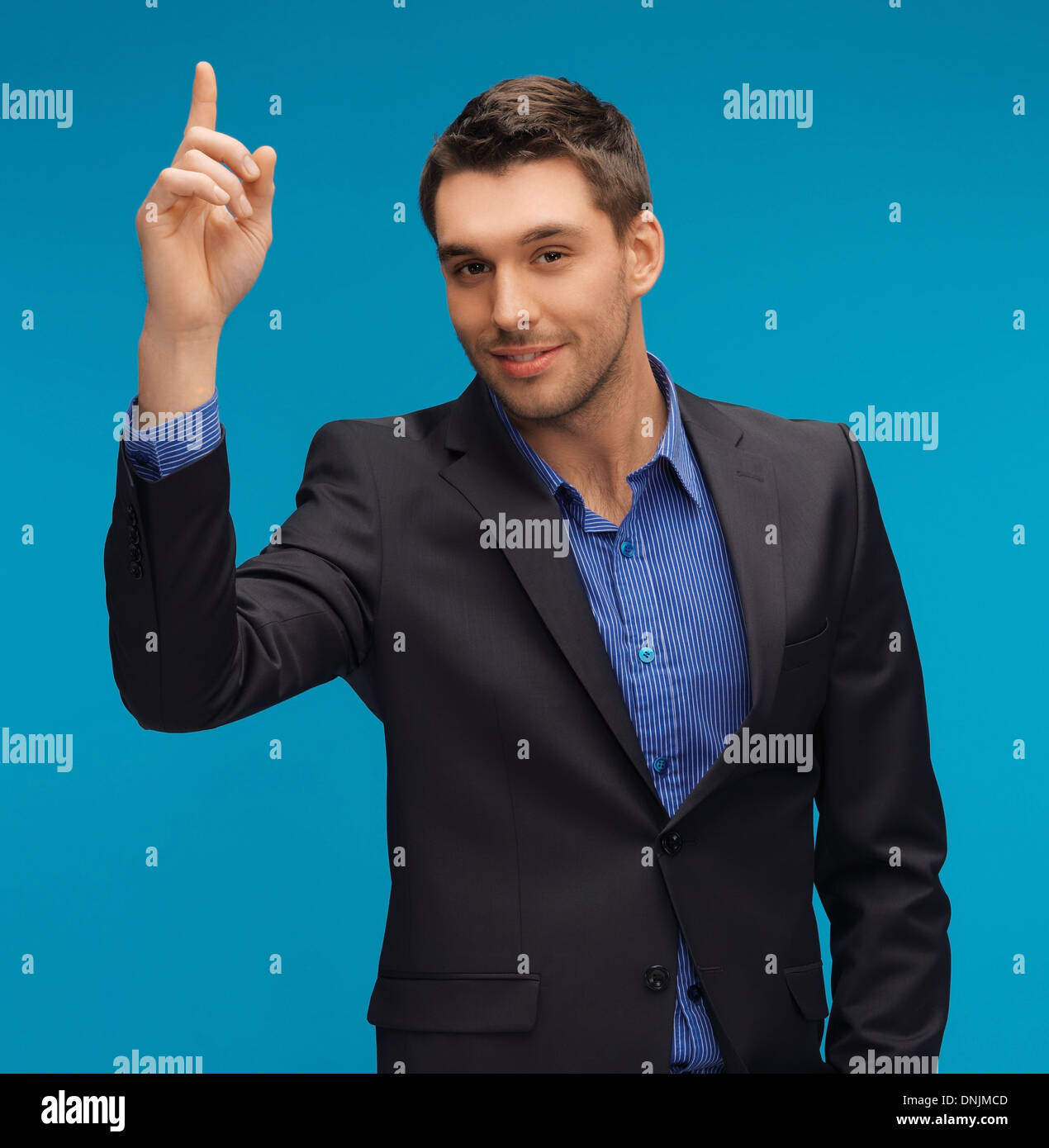 man in suit with his finger up Stock Photo - Alamy