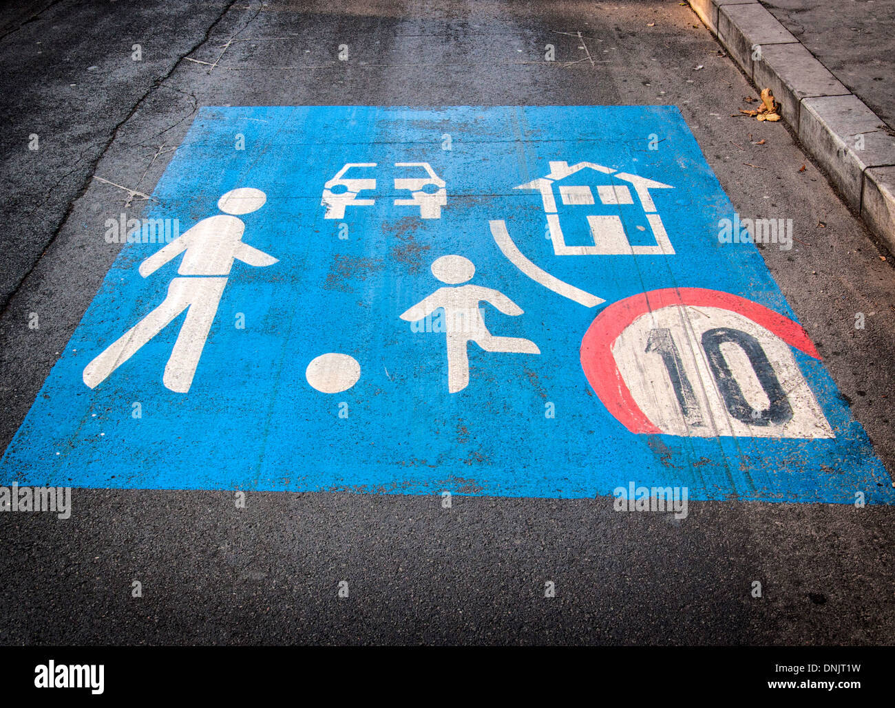 Blue and white playground sign on the road Stock Photo - Alamy