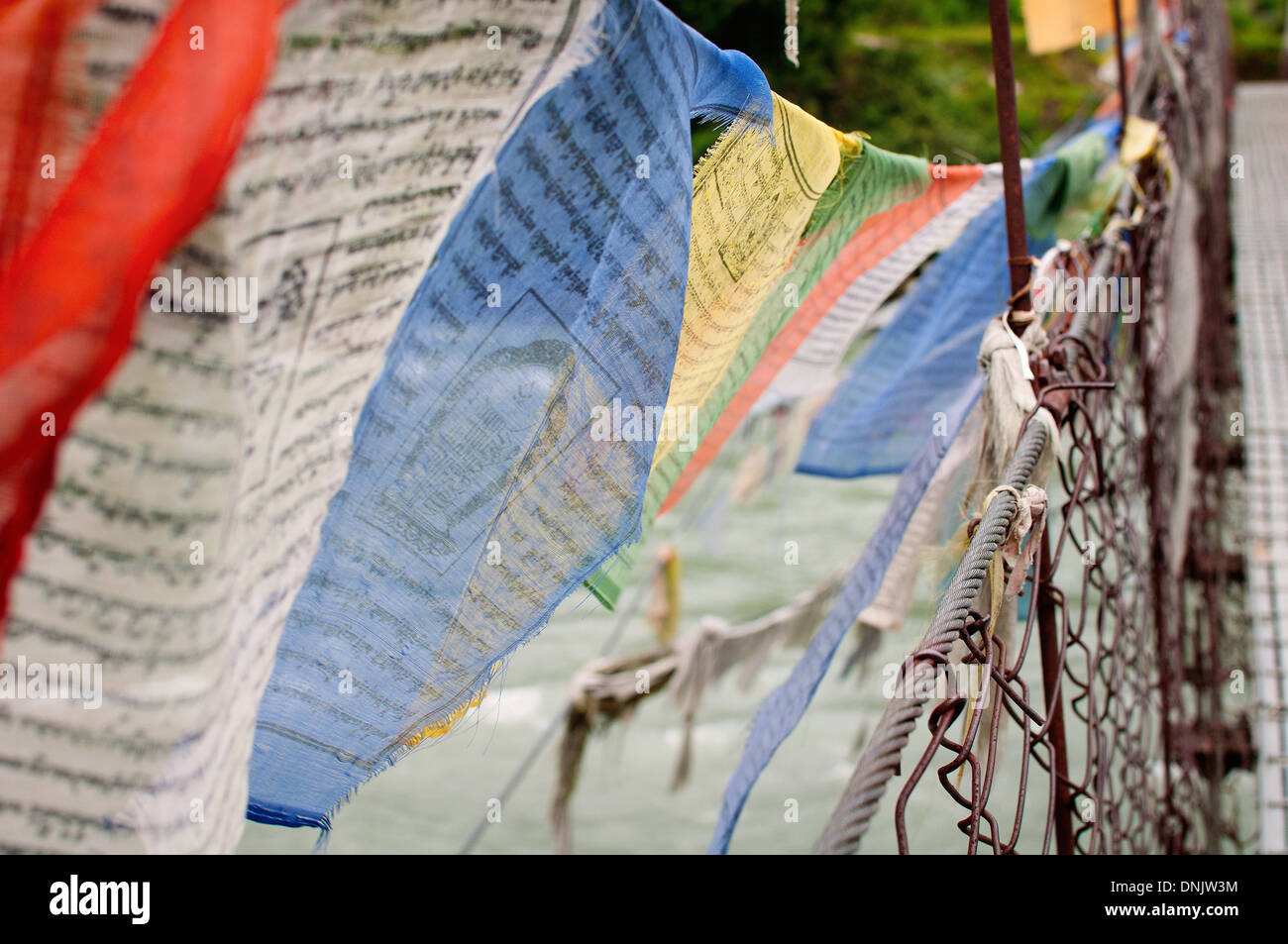 Prayer flags tied to suspension bridge in Thimphu, Bhutan Stock Photo ...