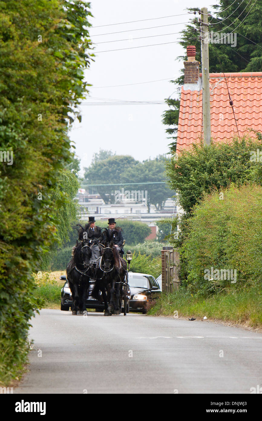 Traditional horse-drawn hearse in funeral procession Stock Photo - Alamy
