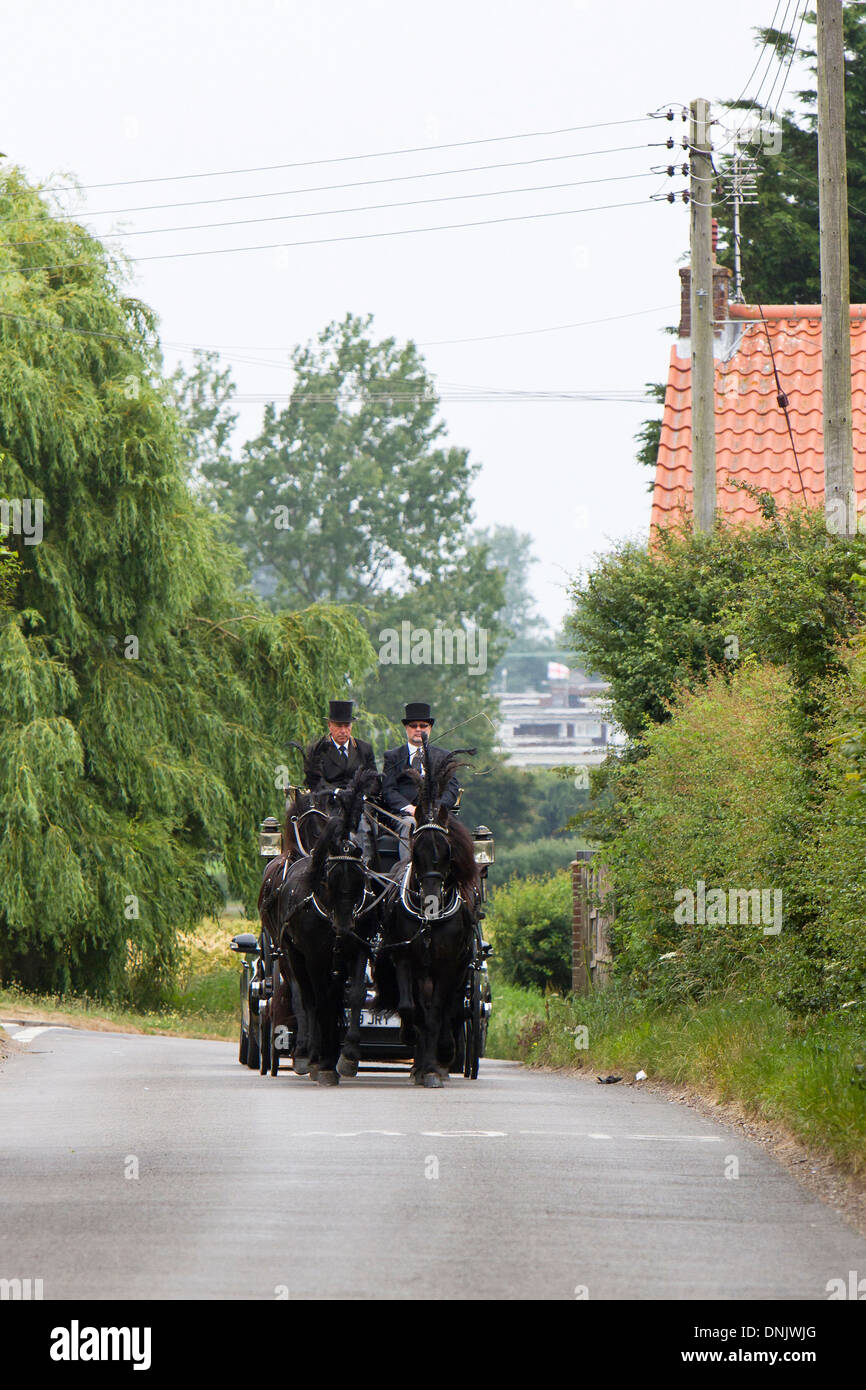 Traditional horse-drawn hearse in funeral procession Stock Photo - Alamy