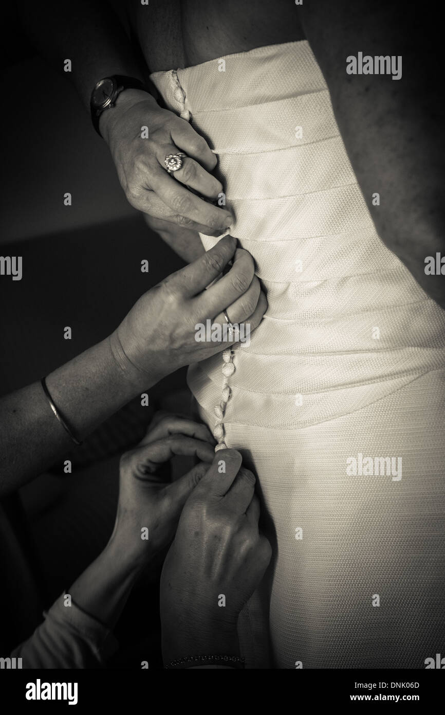 ILLUSTRATION OF WEDDINGS, DRESSING THE BRIDE Stock Photo - Alamy