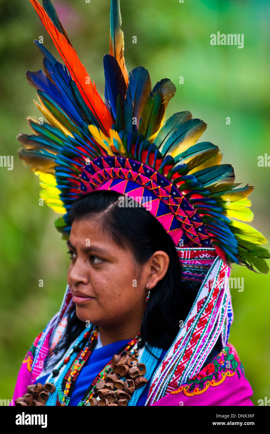 A native from the Kamentsá tribe, wearing a colorful feather headgear ...