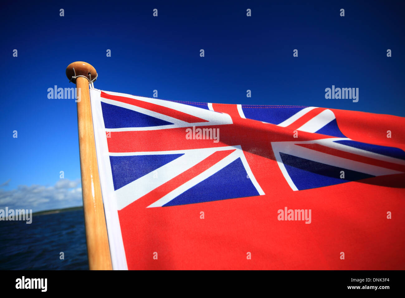 The UK red ensign the british maritime flag flown from a yacht sail ...