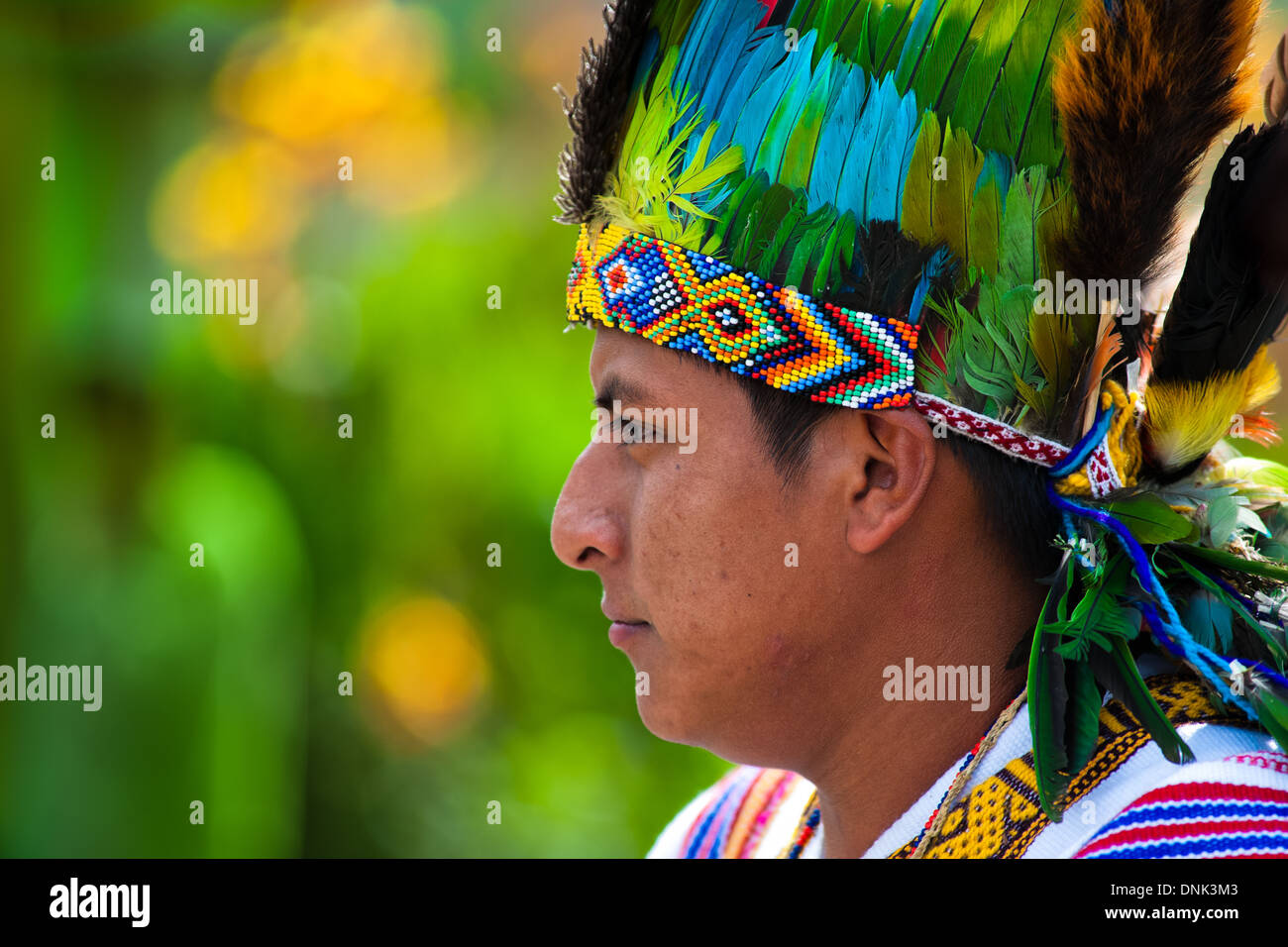 A Colombian Kamentsá native, wearing a colorful headgear, takes part in ...