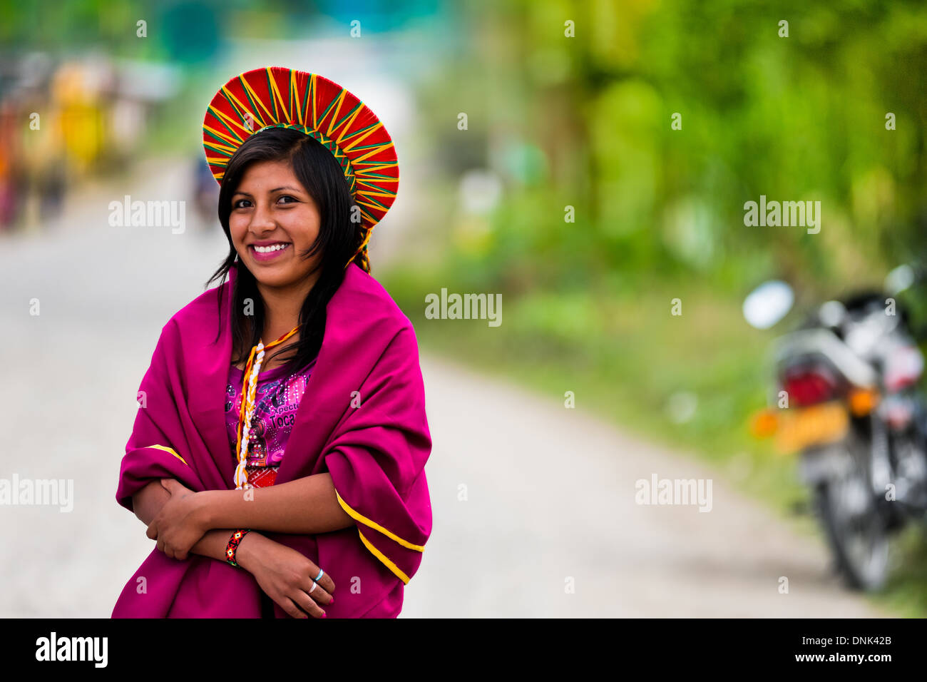 A native girl from the Kamentsá tribe, wearing a colorful costume ...