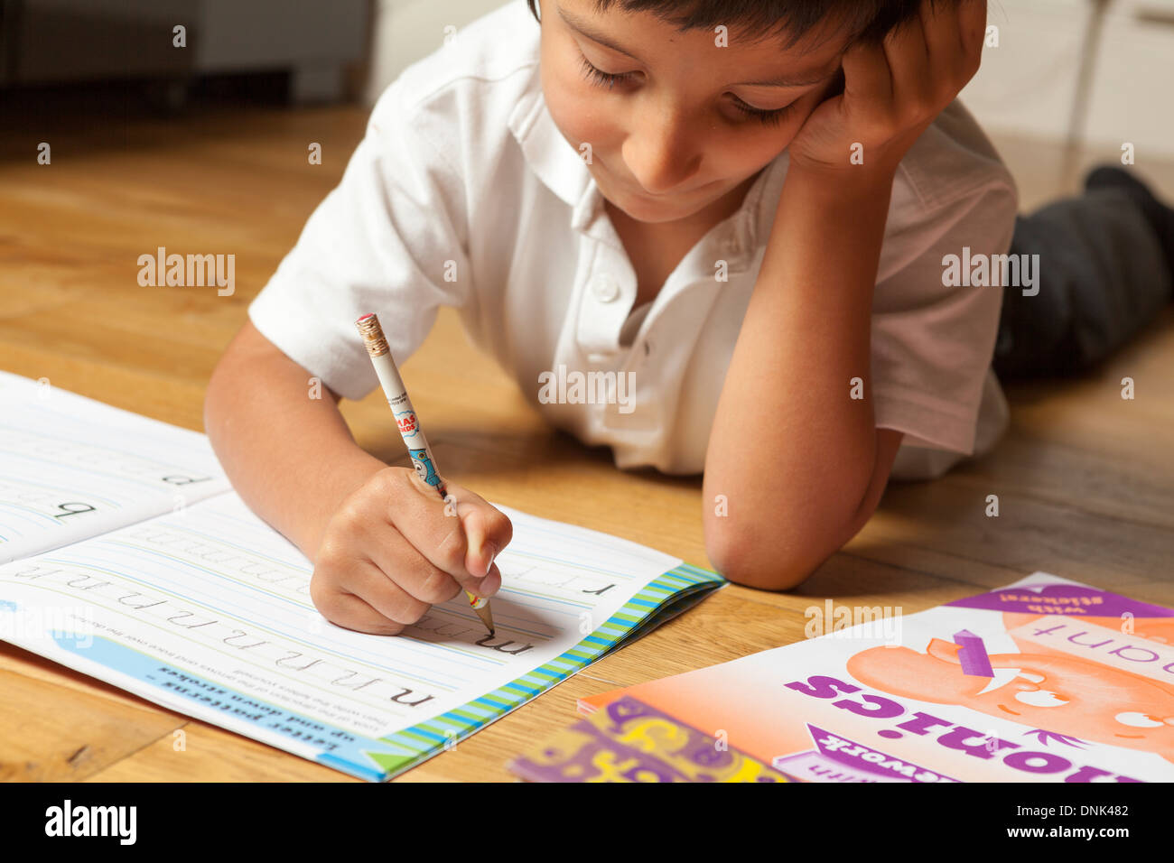 Young boy learning his alphabet Stock Photo - Alamy