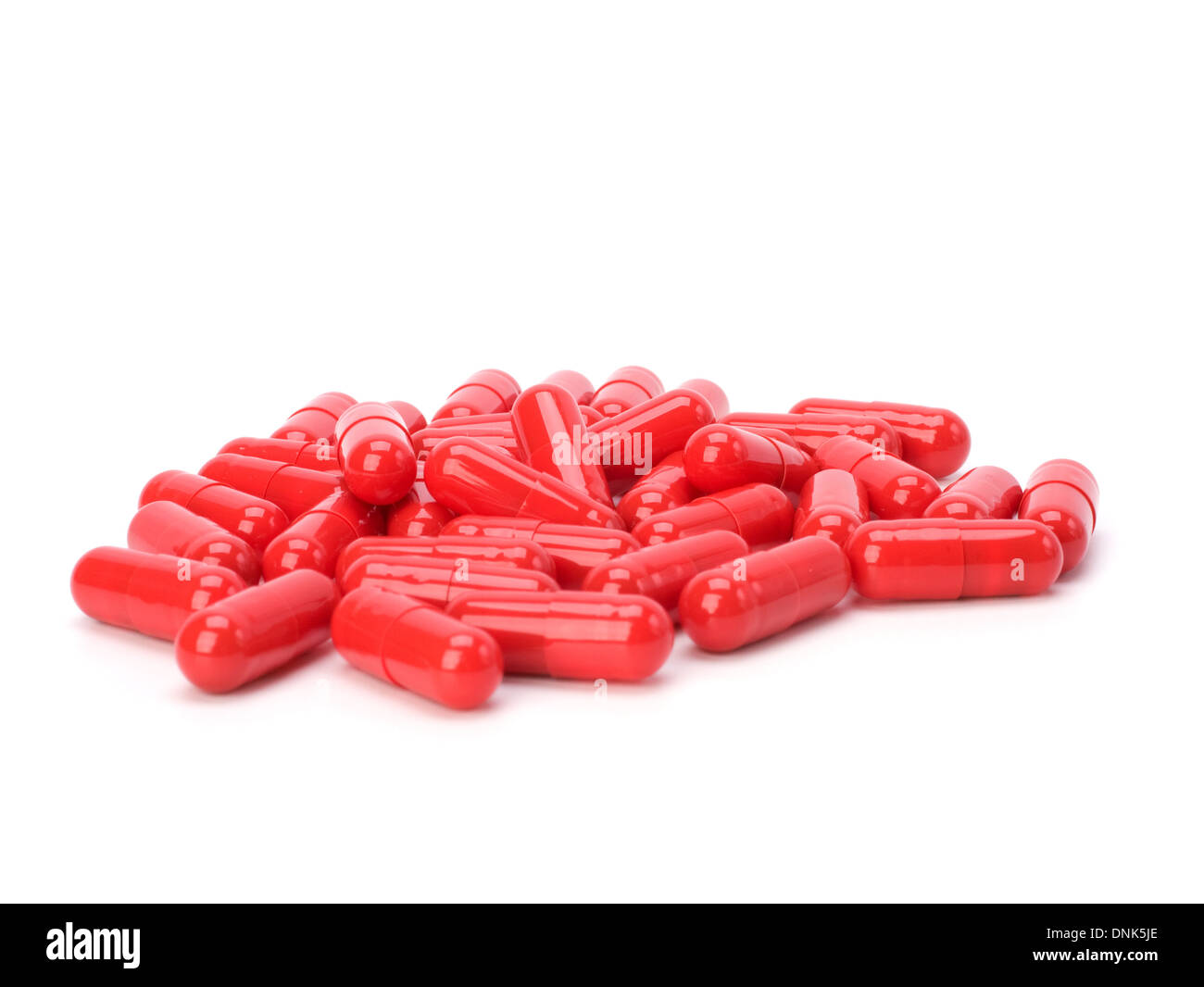 red capsules isolated on white background Stock Photo - Alamy