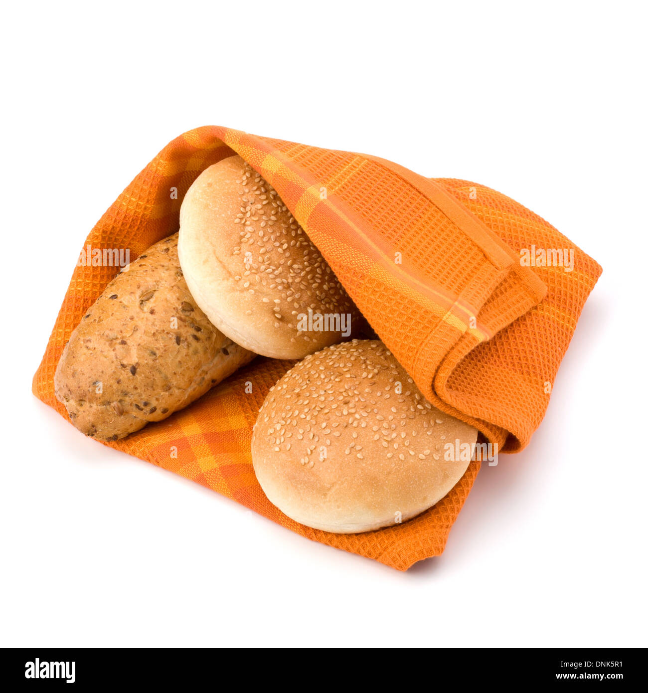 Fresh warm bread over kitchen towel isolated on white background Stock ...